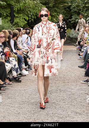 Designer Johnson Hartig walks on the runway at the Libertine fashion ...