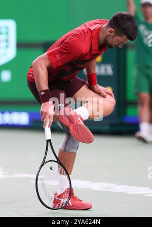Novak Djokovic of Serbia stretches during the Miami Open tennis ...