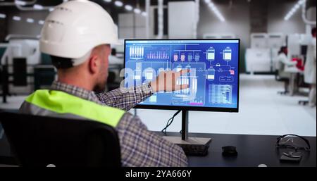 Operator and engineer monitor SCADA system using control Stock Photo ...