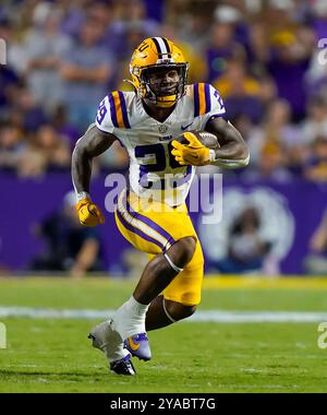LSU Tigers running back Caden Durham (29) runs past Arkansas Razorbacks ...