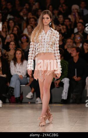 A model walks the runway during Behen fashion show at Lisboa Fashion ...