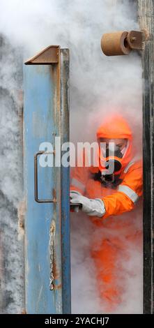 People doing enclosed and confined space fire training Stock Photo - Alamy