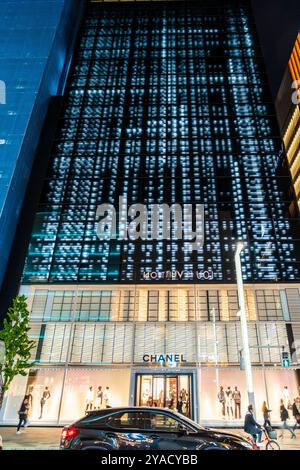 The illuminated facade of the Chanel flagship store in the Tokyo Ginza ...