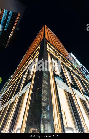 The high rise Cartier flagship store bathed in orange light on the ...