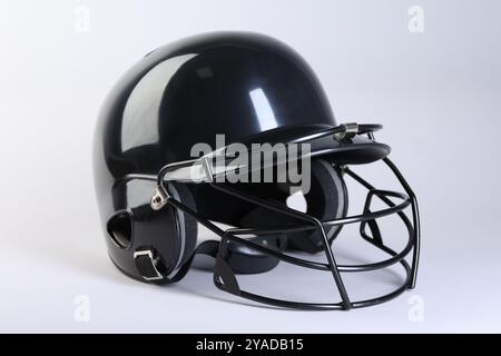 One black baseball helmet on white background Stock Photo - Alamy