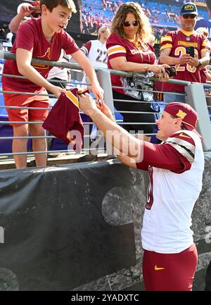 Washington Commanders punter Tress Way (10) interacts with his family ...