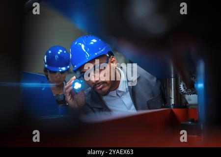 Engineers check control heavy machinery in Industrial factory for ...