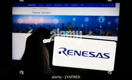 In this photo illustration a Renesas of a Japanese electronics ...