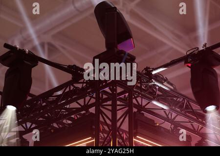 LED stage lighting. Moving heads hanging on truss. Selective focus ...