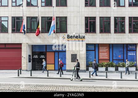 A person walks in front of an electronic stock board showing Japan's ...