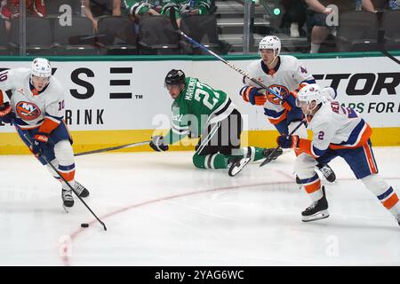 New York Islanders' Simon Holmstrom (10) drives past New York Rangers ...