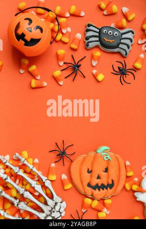 Halloween cookies with pumpkins, spiders and skeleton on pink ...