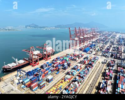 Cargo ships load and unload containers at Lianyungang Port in east ...