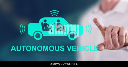 Man touching an autonomous vehicle concept on a touch screen with his ...