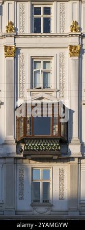 Neoclassical house facade with stucco decorations and a projecting bay ...