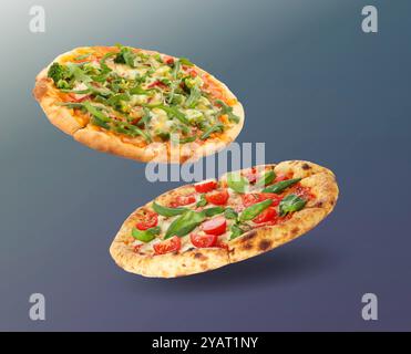 Different pizzas in air on orange gradient background Stock Photo - Alamy