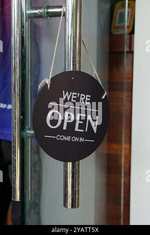 Bright neon open sign hanging in a shop window Stock Photo - Alamy