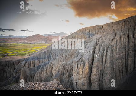 Rock formations and the rapeseed blossoming around Sakya village in the ...