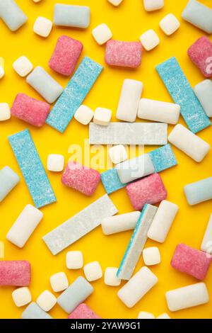 Fresh chewing gums on yellow background Stock Photo - Alamy