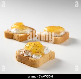 Breakfast. Croutons with cheese and jam on table Stock Photo - Alamy