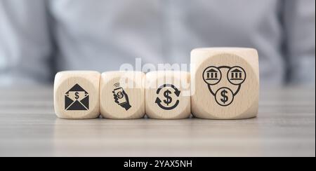 Wooden blocks with symbol of money transfer concept on blue background ...