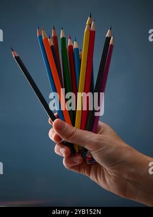 Hand holding Color pencils on a white background Stock Photo - Alamy