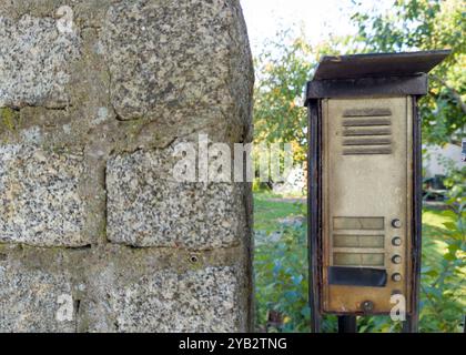 vintage intercom on weathered stone wall Stock Photo - Alamy