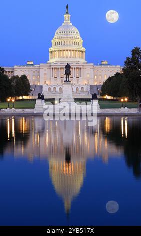 US Capitol illuminated at dusk in Washington DC with nice reflections ...
