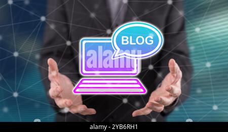 Blog concept above the hands of a man in background Stock Photo - Alamy