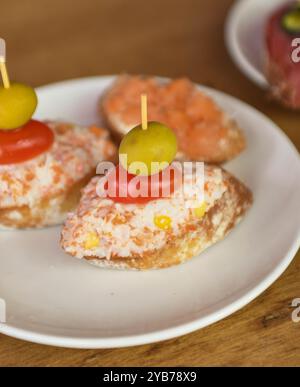 Various typical Spanish canapes, with ham, crab and tuna Stock Photo ...