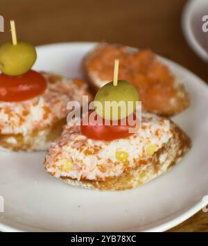 Various typical Spanish canapes, with ham, crab and tuna Stock Photo ...