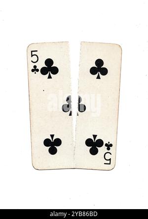 A vintage playing card torn in half from top to bottom on a white ...