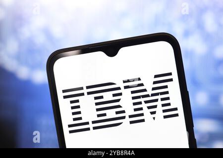 In this photo illustration, the IBM company logo is seen displayed on a ...