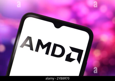 In this photo illustration, the AMD (Advanced Micro Devices) logo is seen displayed on a ...
