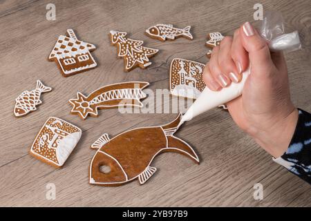Preparation of homemade Christmas cookies - pressing the dough into nut ...