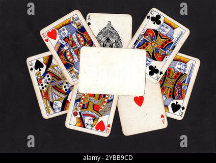 A montage of vintage playing cards with a blank card in the middle on a ...