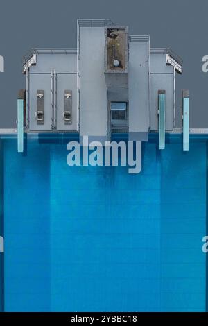 View from above diving platforms and diving boards above green swimming ...