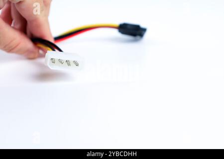 Hand holding IDE to Sata connector adapter on white background Stock ...