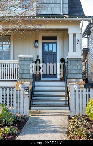 Metal porch railings in front of entrance door to country house are ...