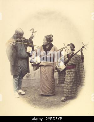 Portrait of a woman playing the shamisen; The Samisen Stock Photo - Alamy