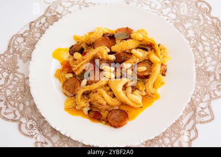 Beef tripe (bucho), beef stomach, tripe on a white plate. Dobradinha ...