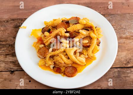 Beef tripe (bucho), beef stomach, tripe on a white plate. Dobradinha ...