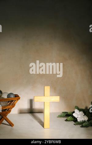 Cross with manger and decorations on grunge background. Concept of ...