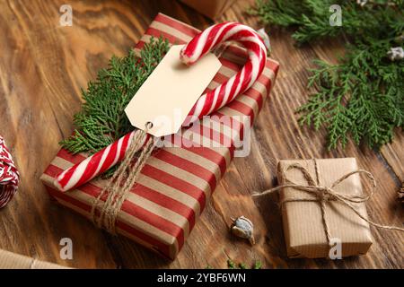 Beautiful Christmas gifts and thuja branches on green background ...