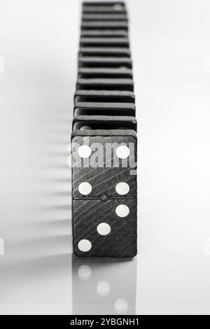 Composition of standing black domino bricks with white dots Stock Photo ...