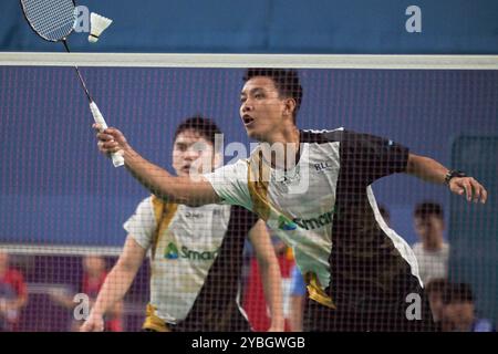 Singapore' s Koh Eng Keat Wesley, left, and Kubo Junsuke play South Korea's Won Ho Kim, left ...