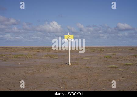 Sign: Caution - deep mud, seen in Southport, Merseyside, England, UK ...