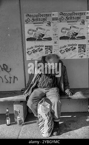 Germany, Berlin, 18 October 1991, a homeless man in a bus shelter in ...
