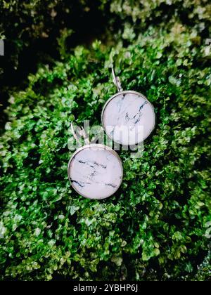 Shiny Silver earrings Round design Hanging for girls and women Stock ...