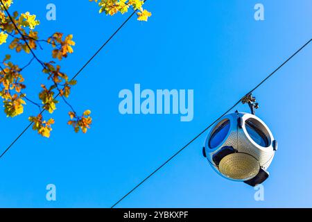 a cable car with round passenger cabins. cable car against blue sky ...